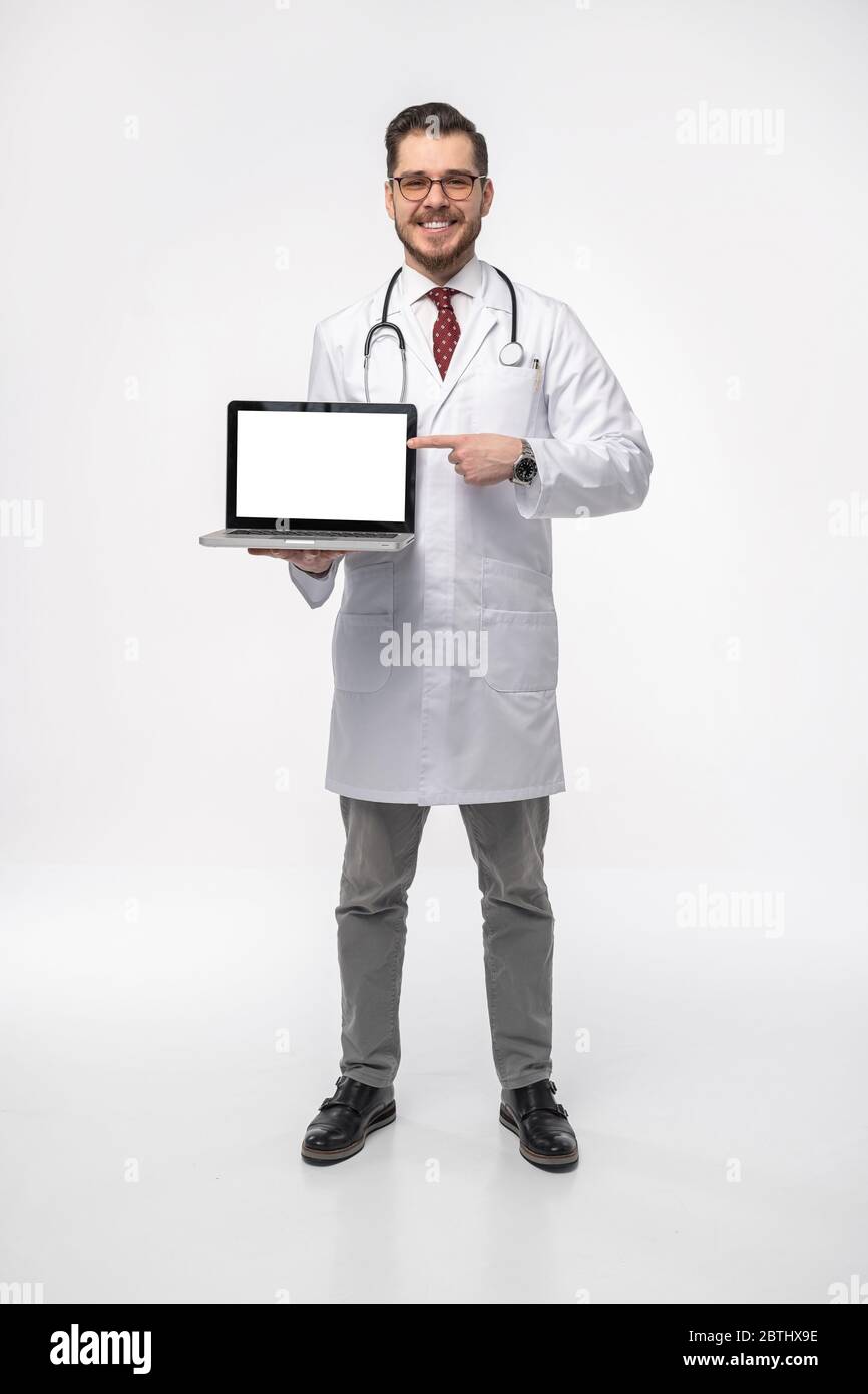 Smiling medical doctor. Isolated over white background Stock Photo - Alamy