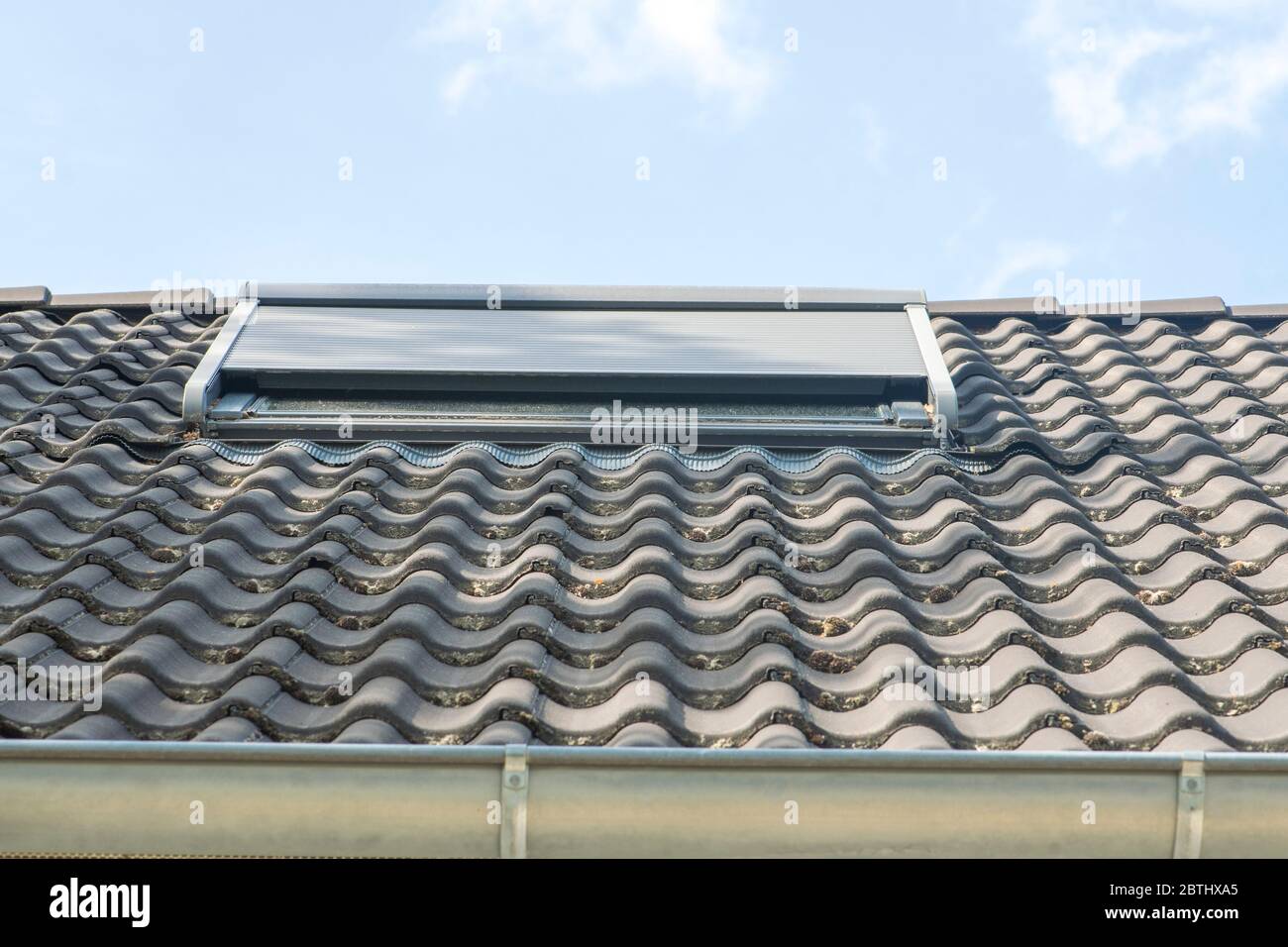 modern house with skylight with blackout and gutter Stock Photo - Alamy