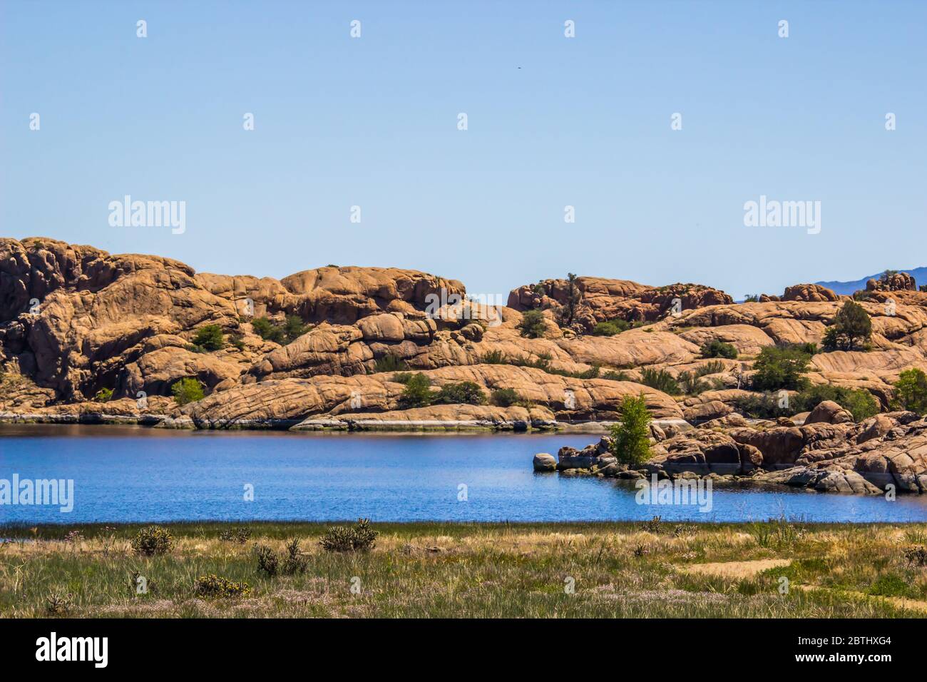 Rock Shoreline At Mountain Lake Stock Photo - Alamy