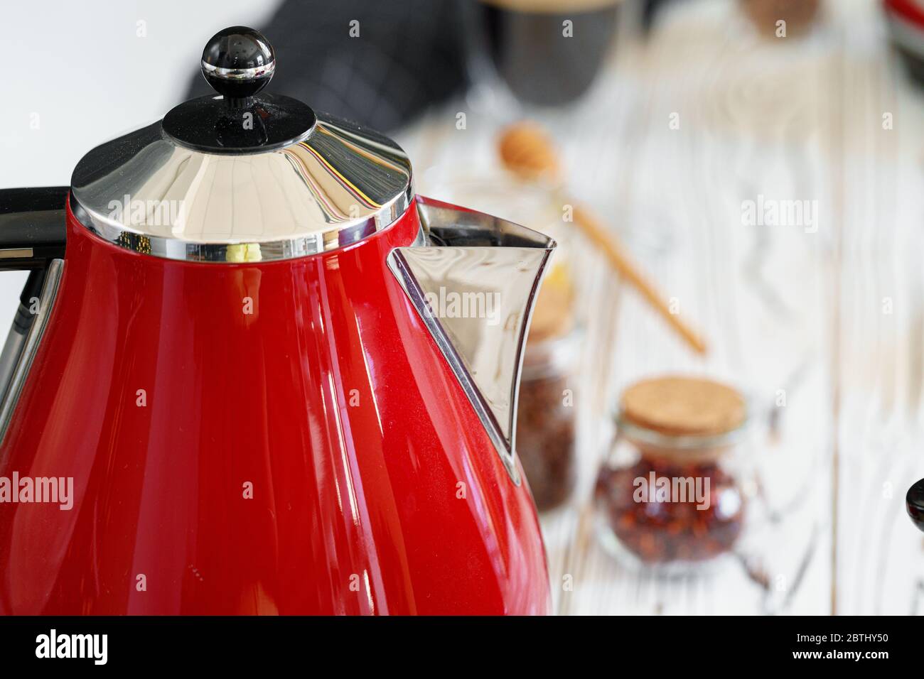 Red kettle on kitchen counter close up Stock Photo - Alamy