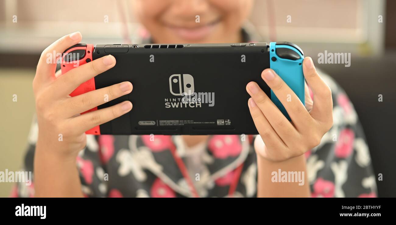 CHIANGMAI, THAILAND - 2 May 2020, Girl playing game on Nintendo Switch ...