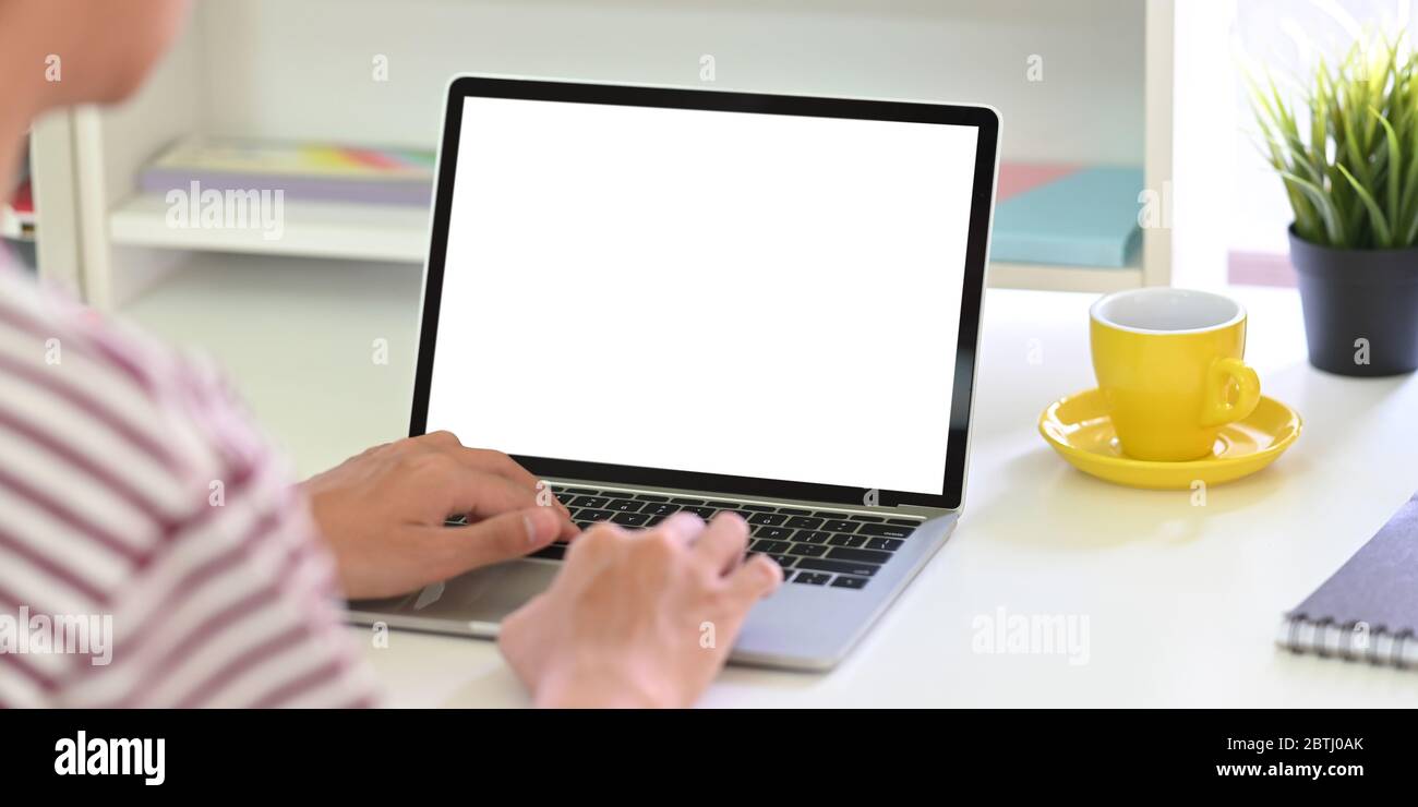 Back shot of smart man typing on white blank screen computer laptop ...