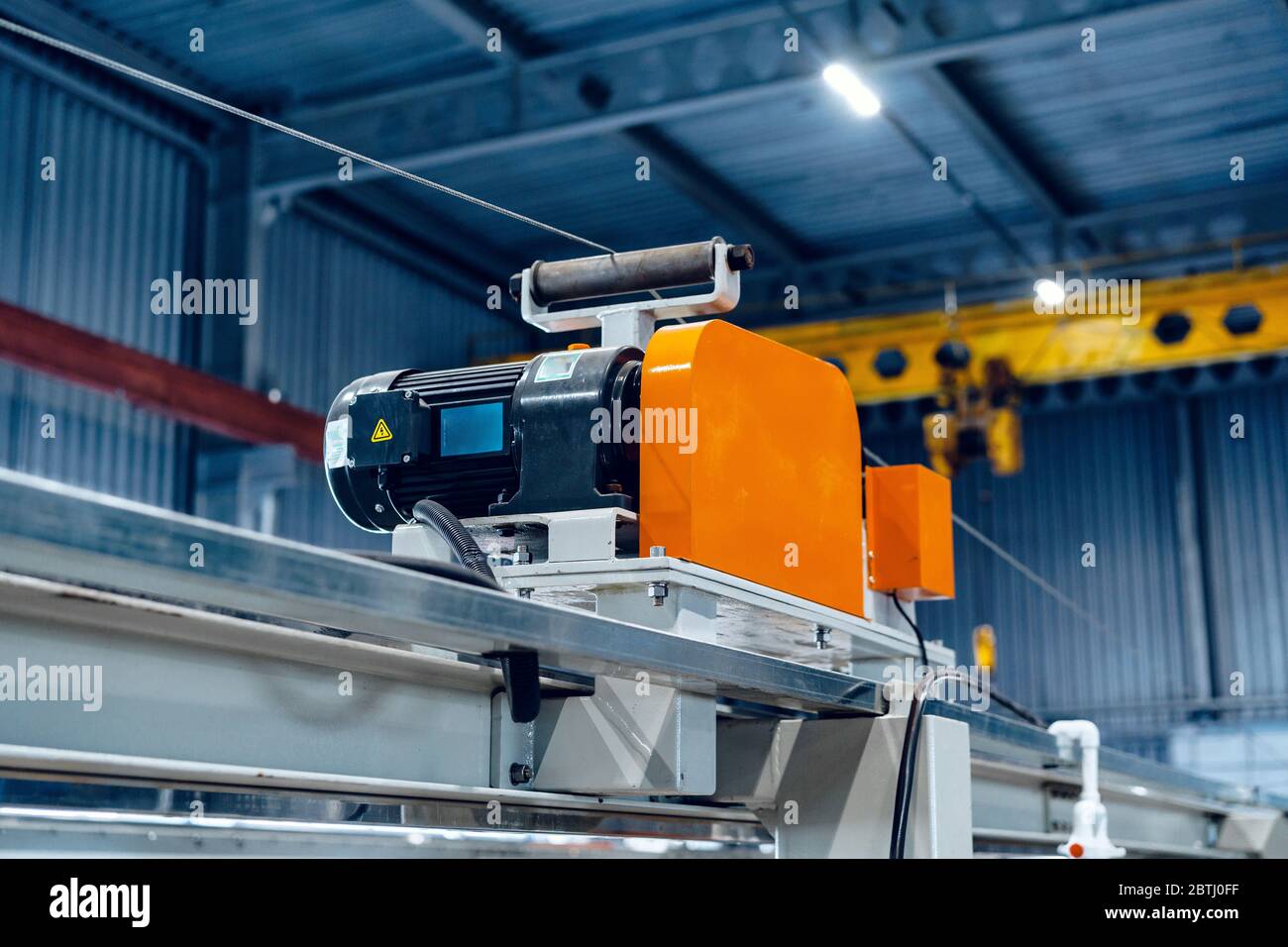 Close up photo of production in the industry with various machines ...