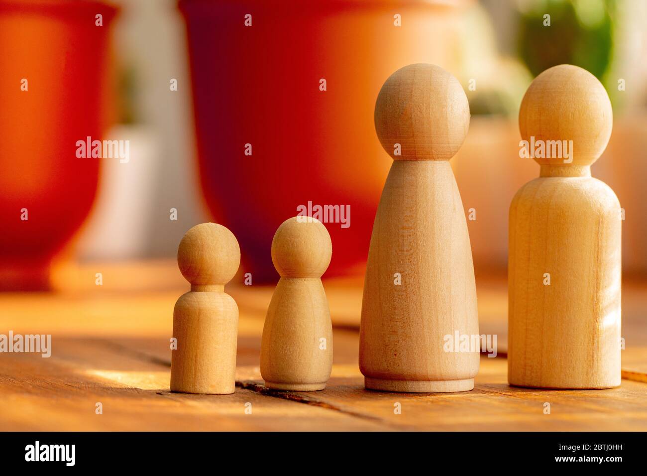 Small wooden figures of family members. Family relationship symbol ...