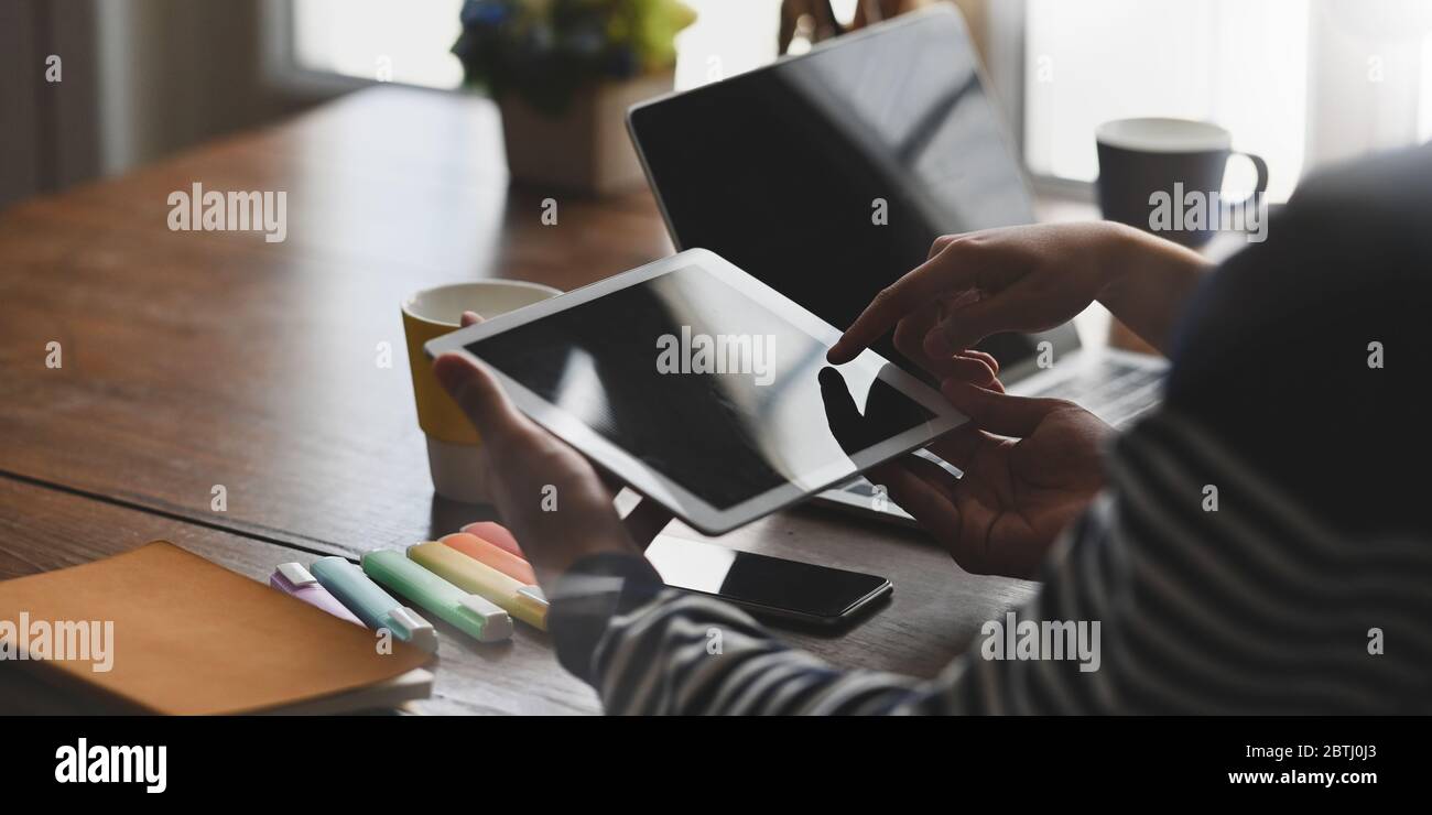 Business people working with computer tablet and laptop while sitting ...