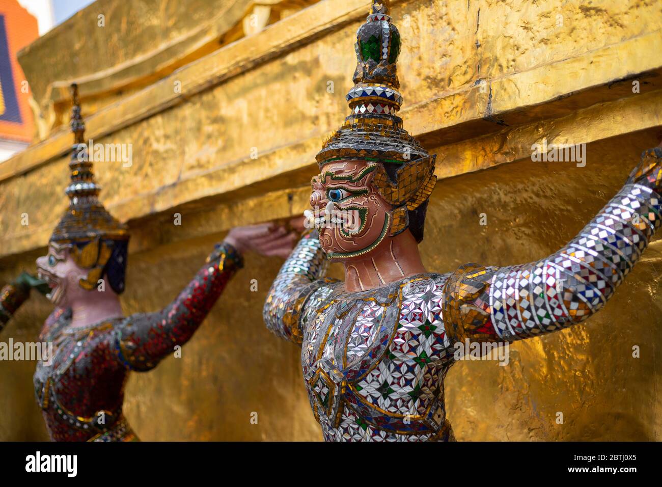Gold demons guard facades and entrances at Grand Palace, Bangkok ...
