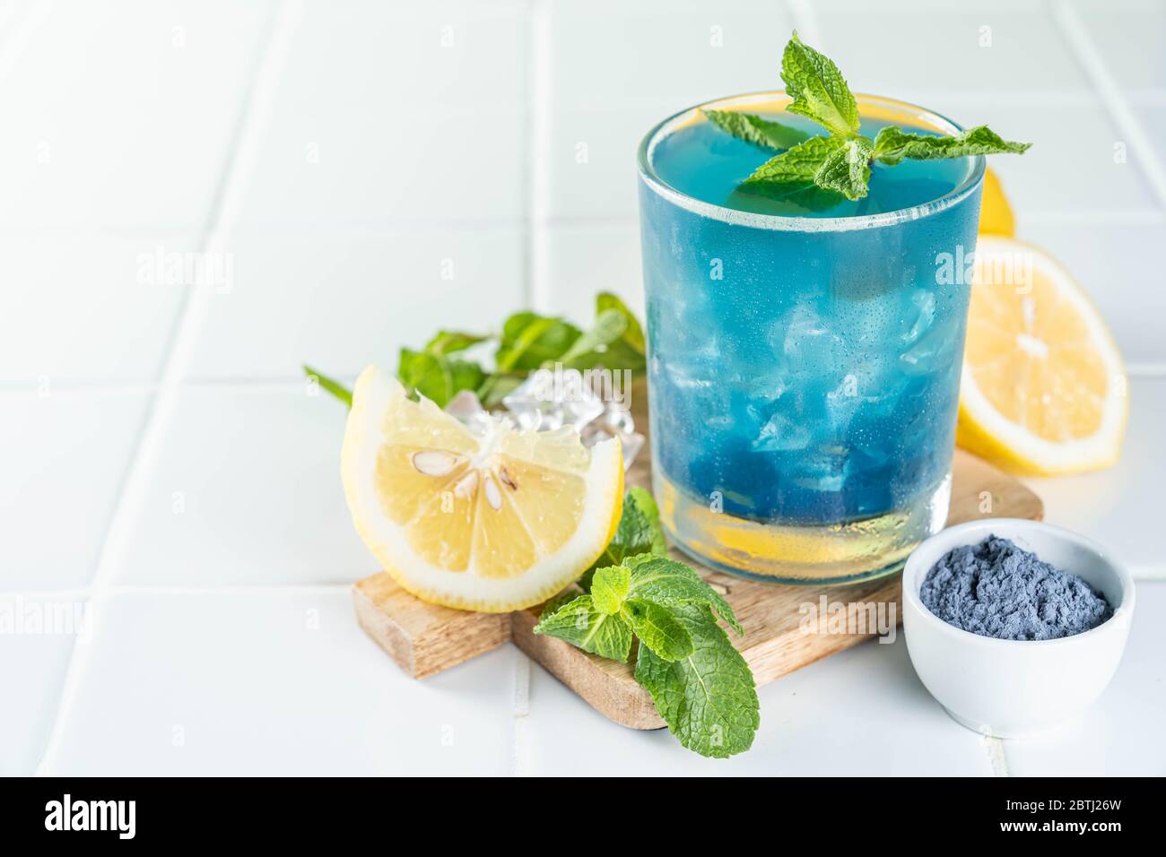 Blue matcha lemonade on white background Stock Photo - Alamy