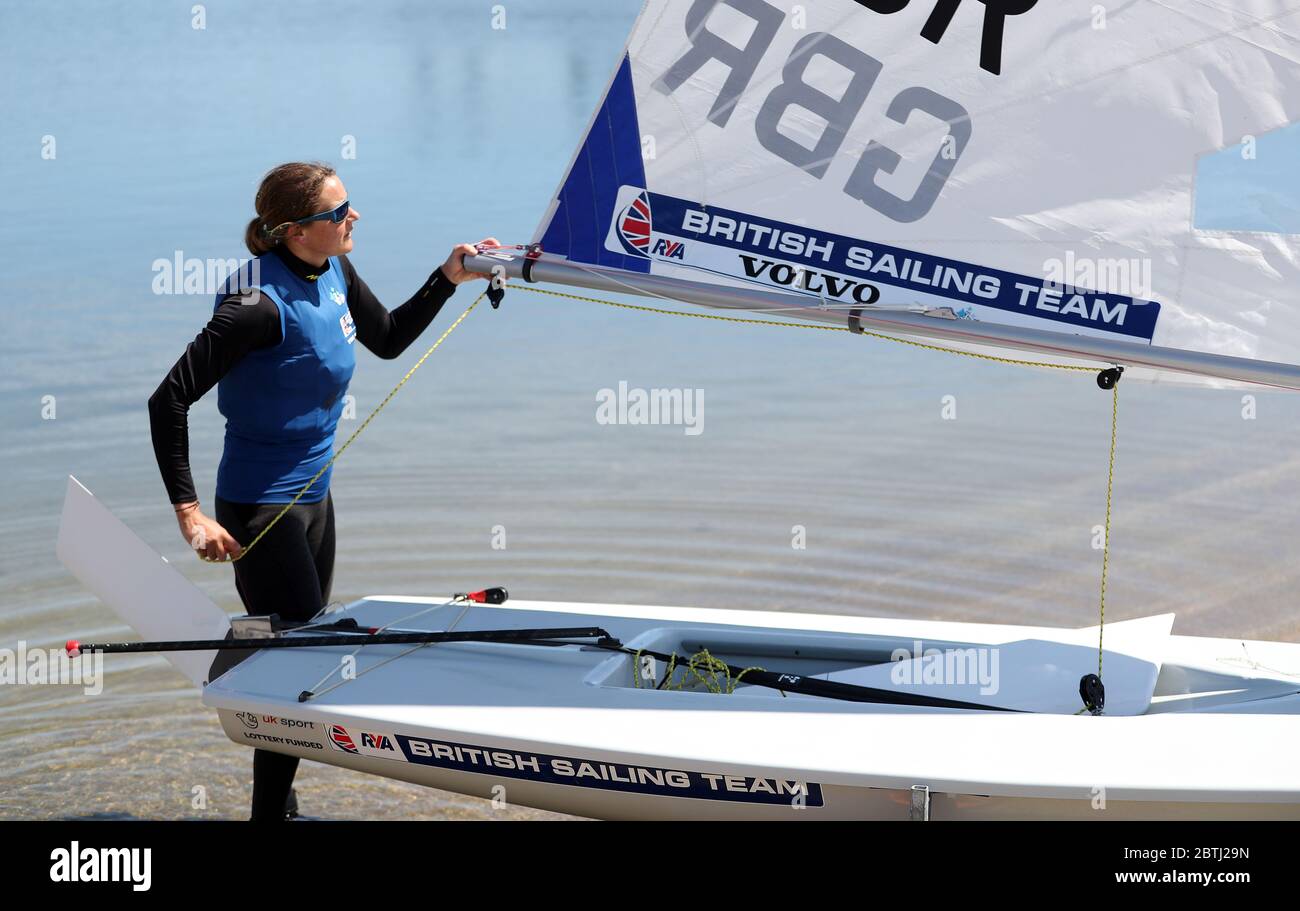Great Britain's Alison Young walks her Laser Radial dingy into the ...