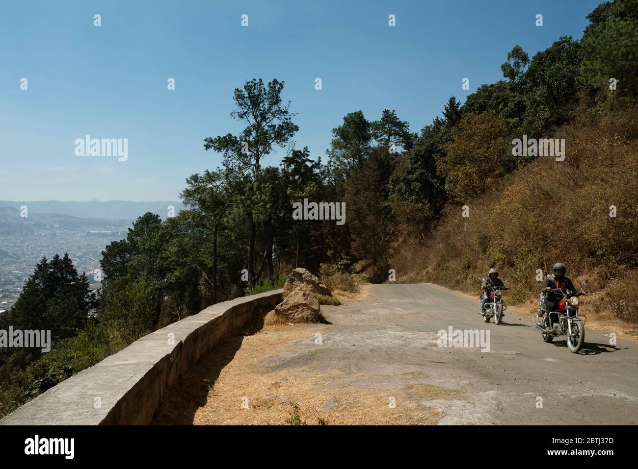 Bike riders in Cerro El Baúl (El Baul hill) national park ...