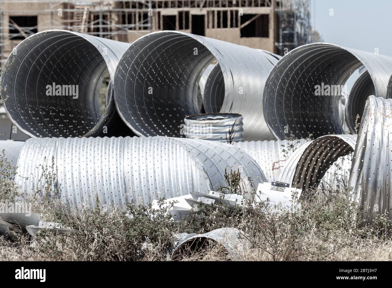 Perforated culvert stacked for use at a construction site in Modesto ...