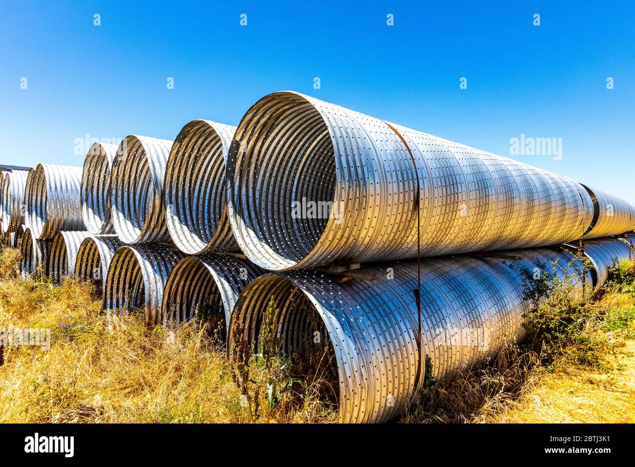 Perforated culvert stacked for use at a construction site in Modesto ...