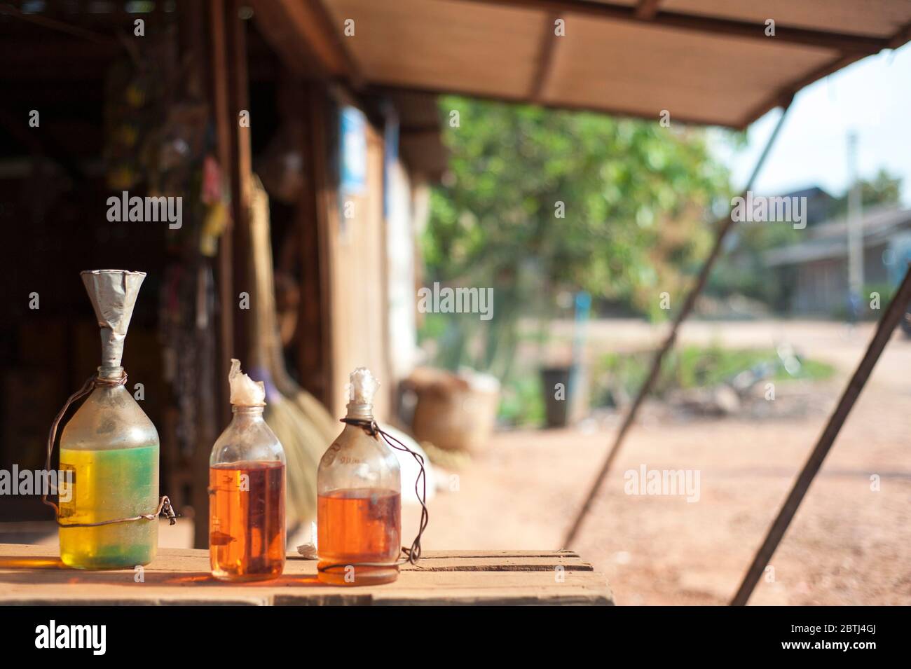 Coloured liquids in different shape bottles Stock Photo - Alamy