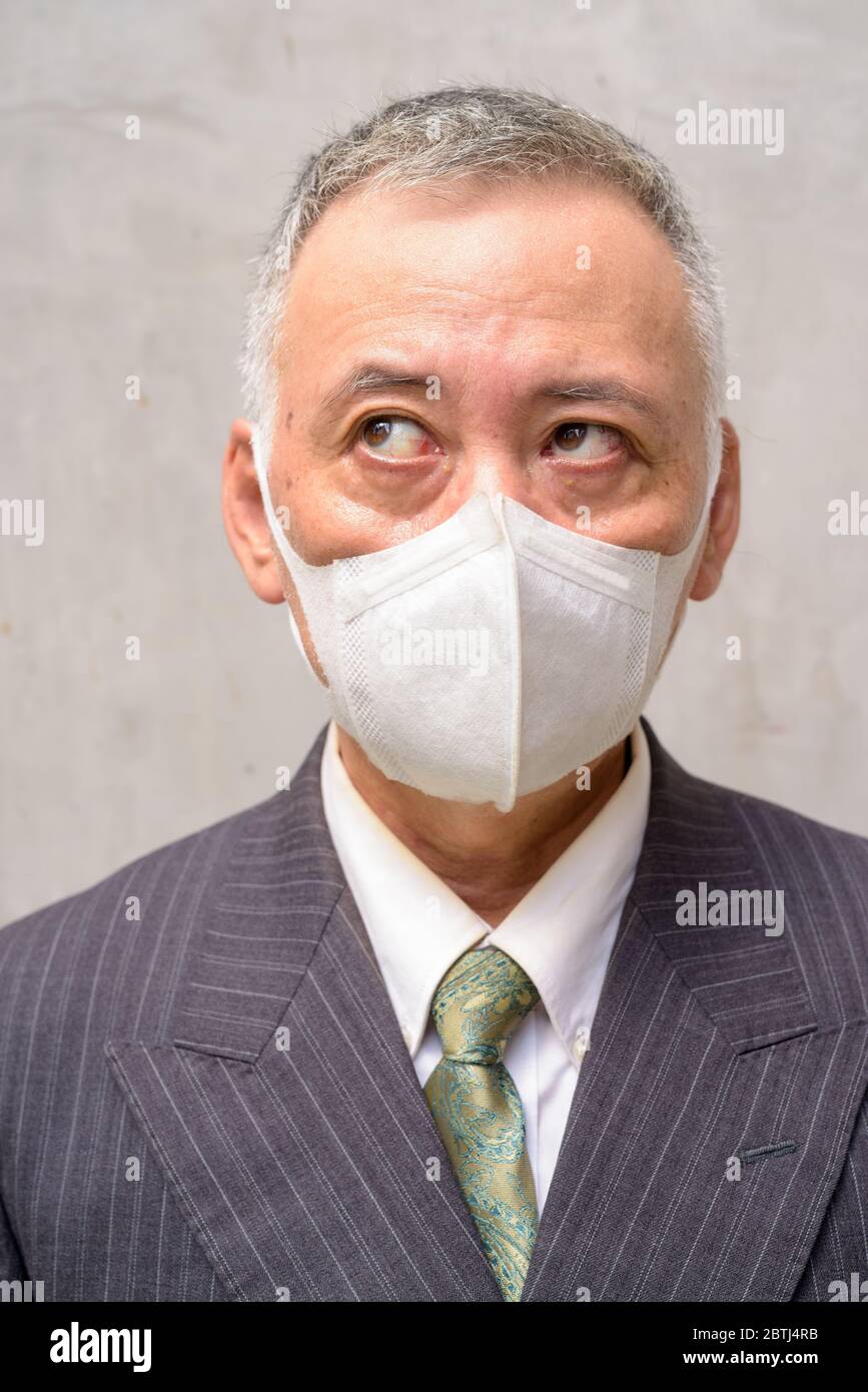 Thoughtful asian man mask hi-res stock photography and images - Alamy