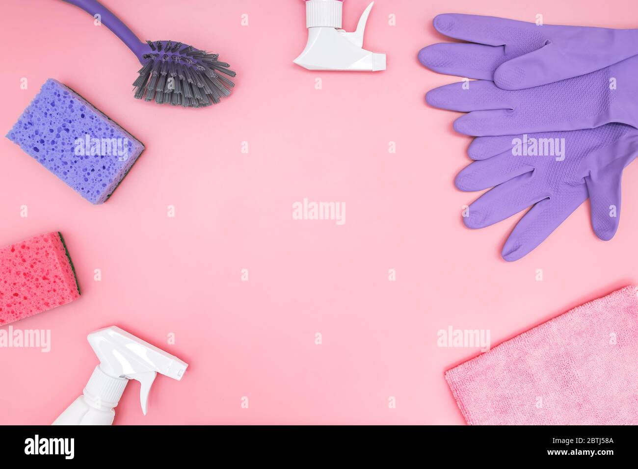 Cleaning tools and supplies on pink background Stock Photo - Alamy