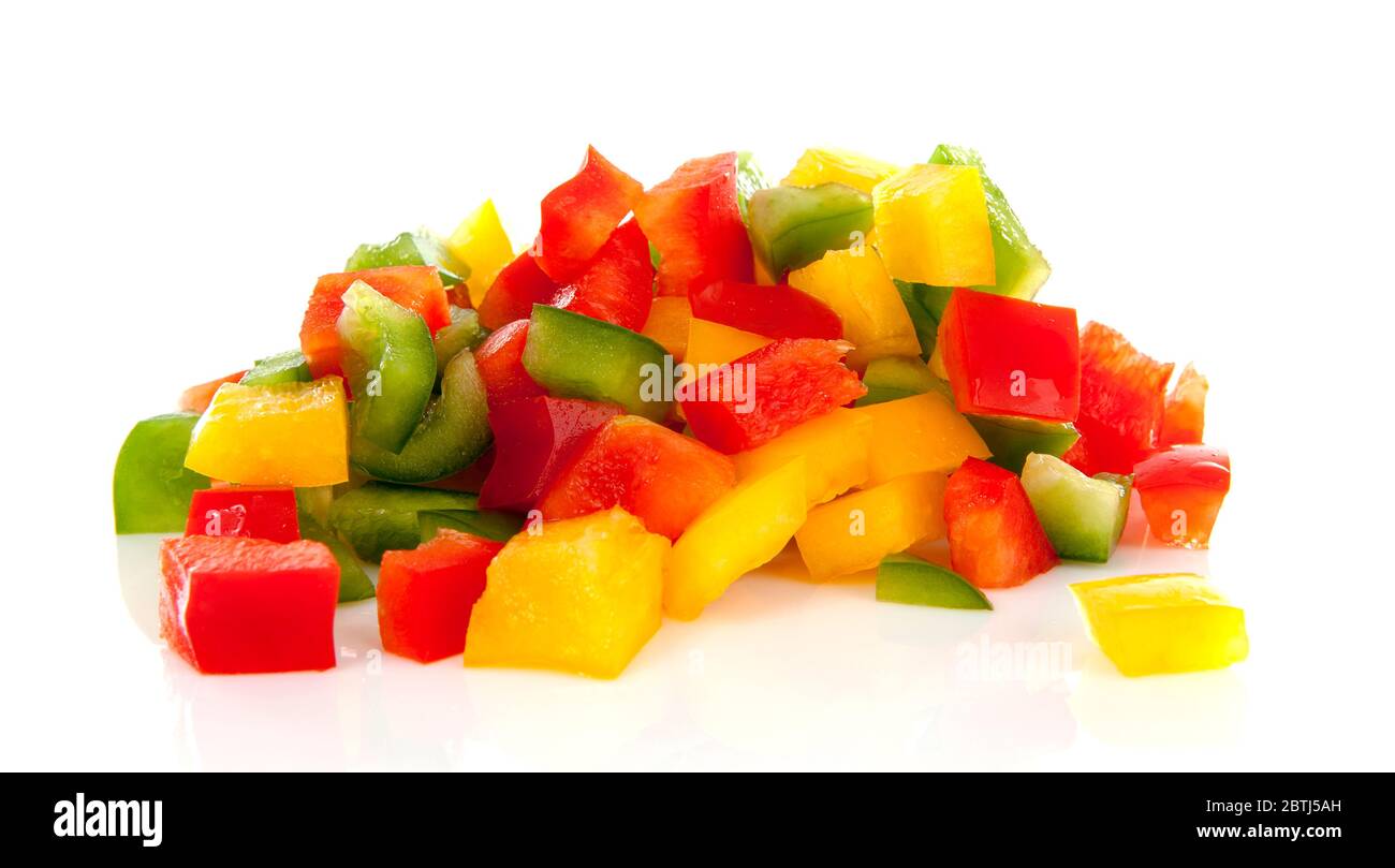 Pile of fresh chopped paprika over white background Stock Photo - Alamy