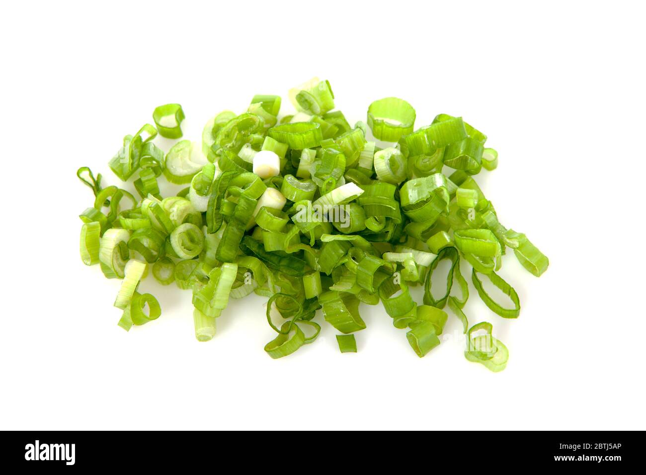 Pile of fresh chopped spring onion over white background Stock Photo ...