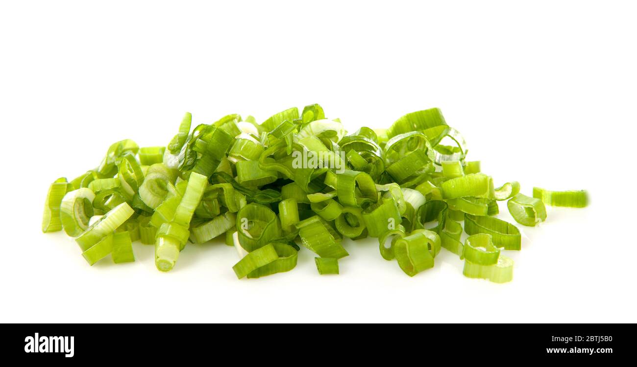 Pile of fresh chopped spring onion over white background Stock Photo ...