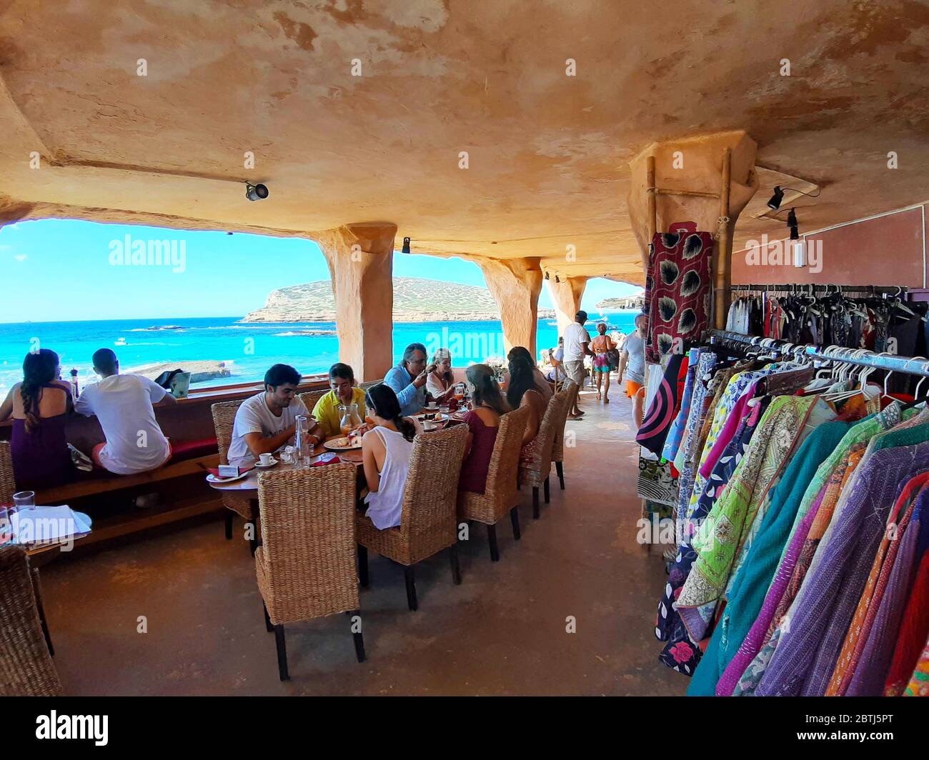 the bar restaurant and bazaar in cala comte nestled in the cliff rock ...