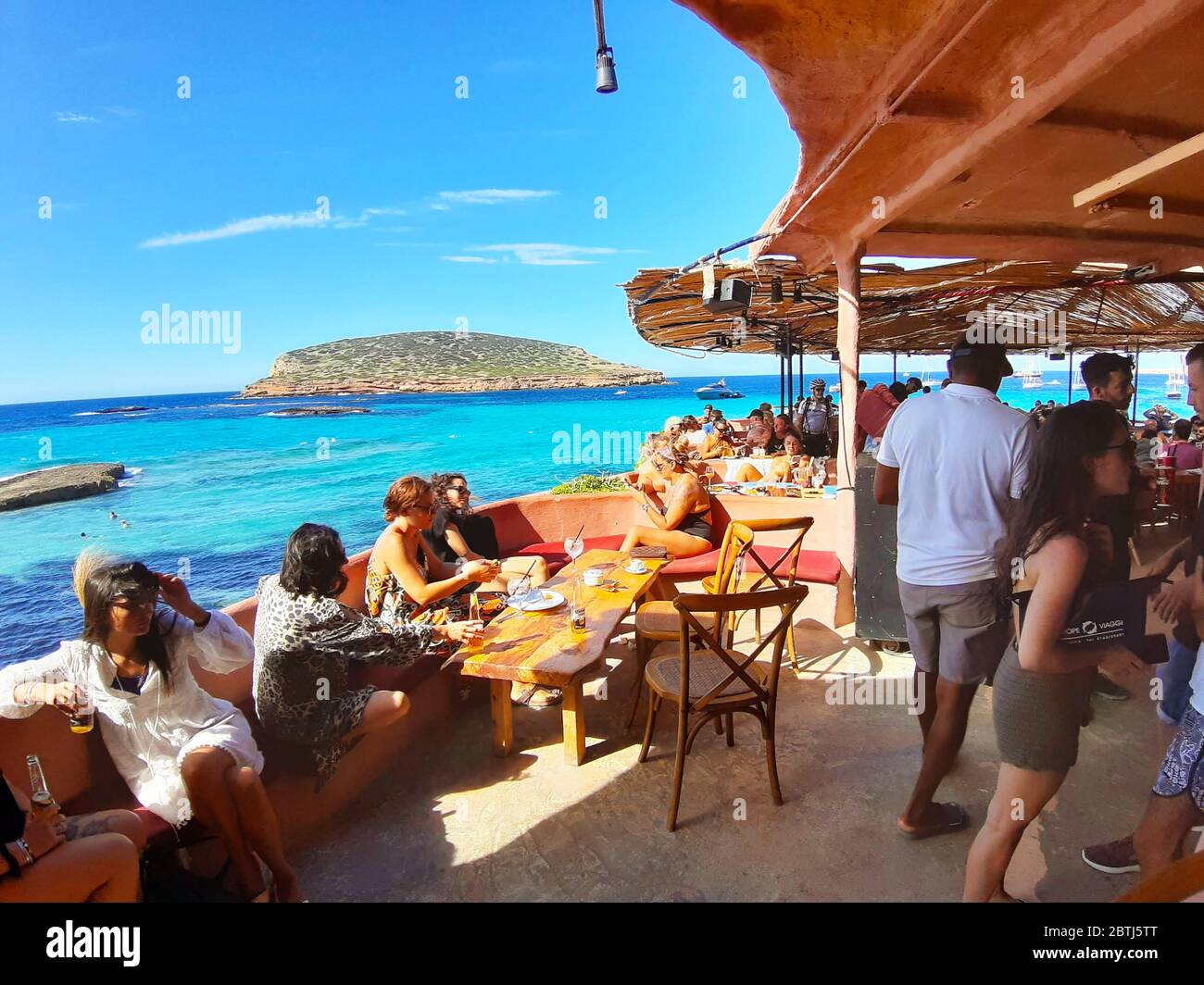 the bar restaurant and bazaar in cala comte nestled in the cliff rock ...