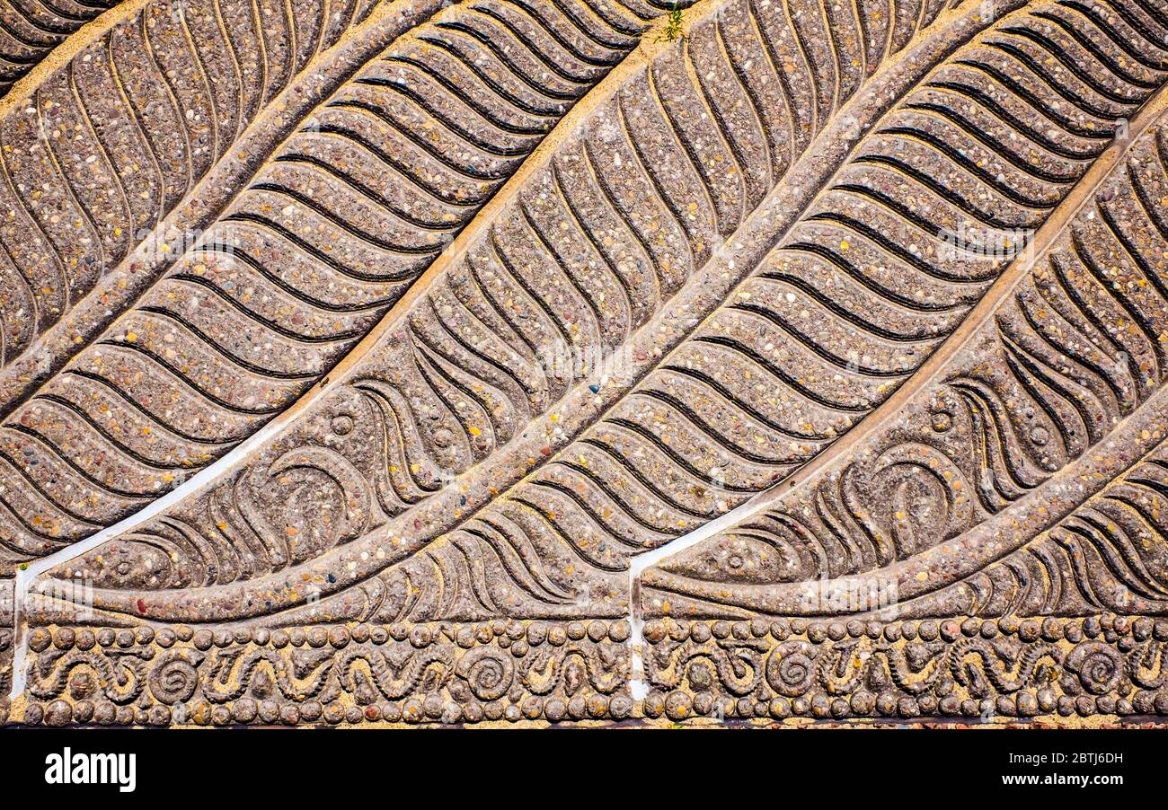 feather like carved pattern in stone concrete Stock Photo - Alamy