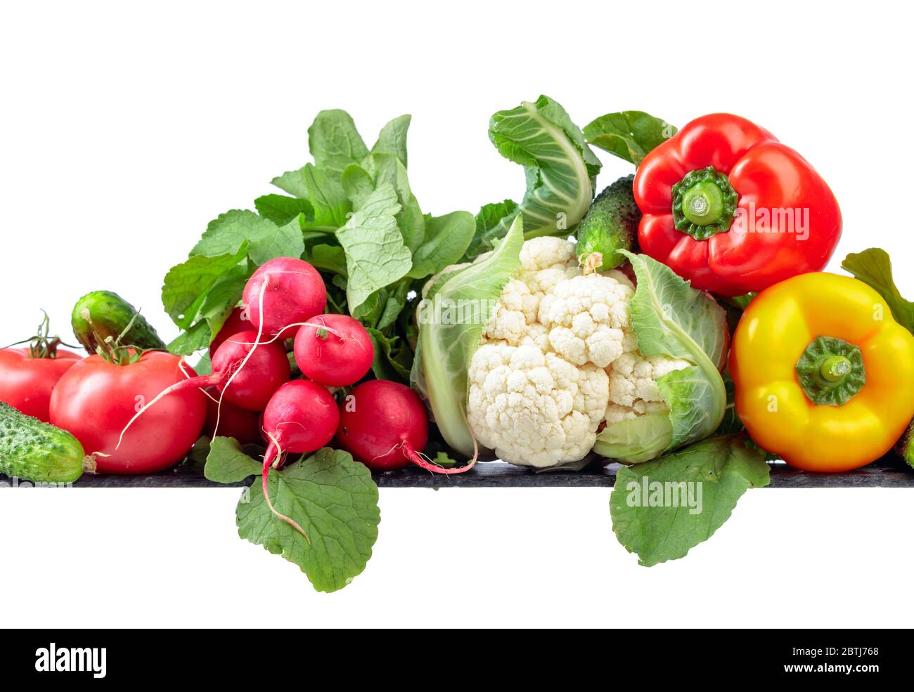Various fresh raw vegetables, frontal view, isolated on white ...