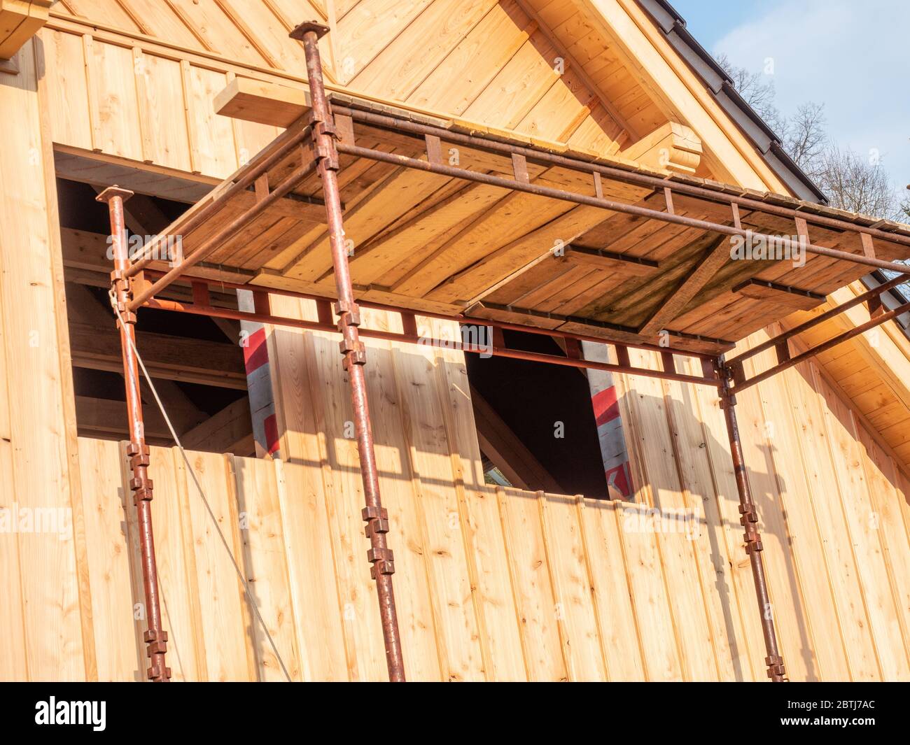 Foldable scaffolding at new wooden country house under construction ...