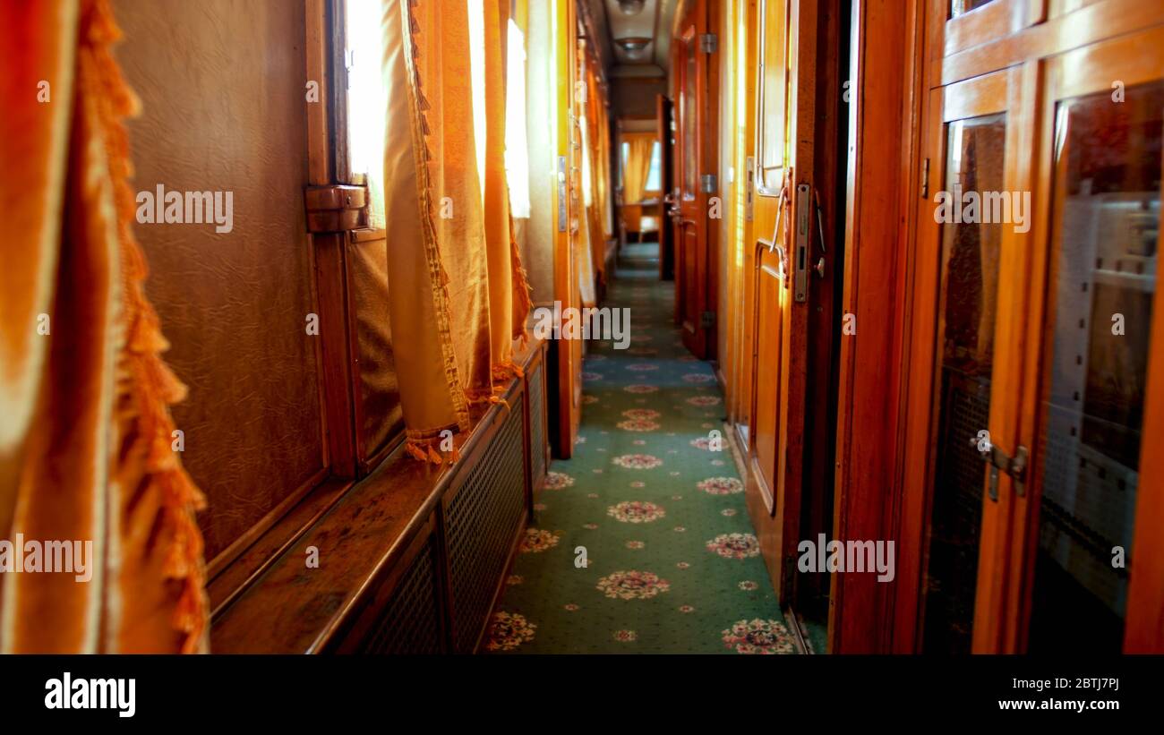 Interior of old wooden train wagon with wooden walls and carpets on ...