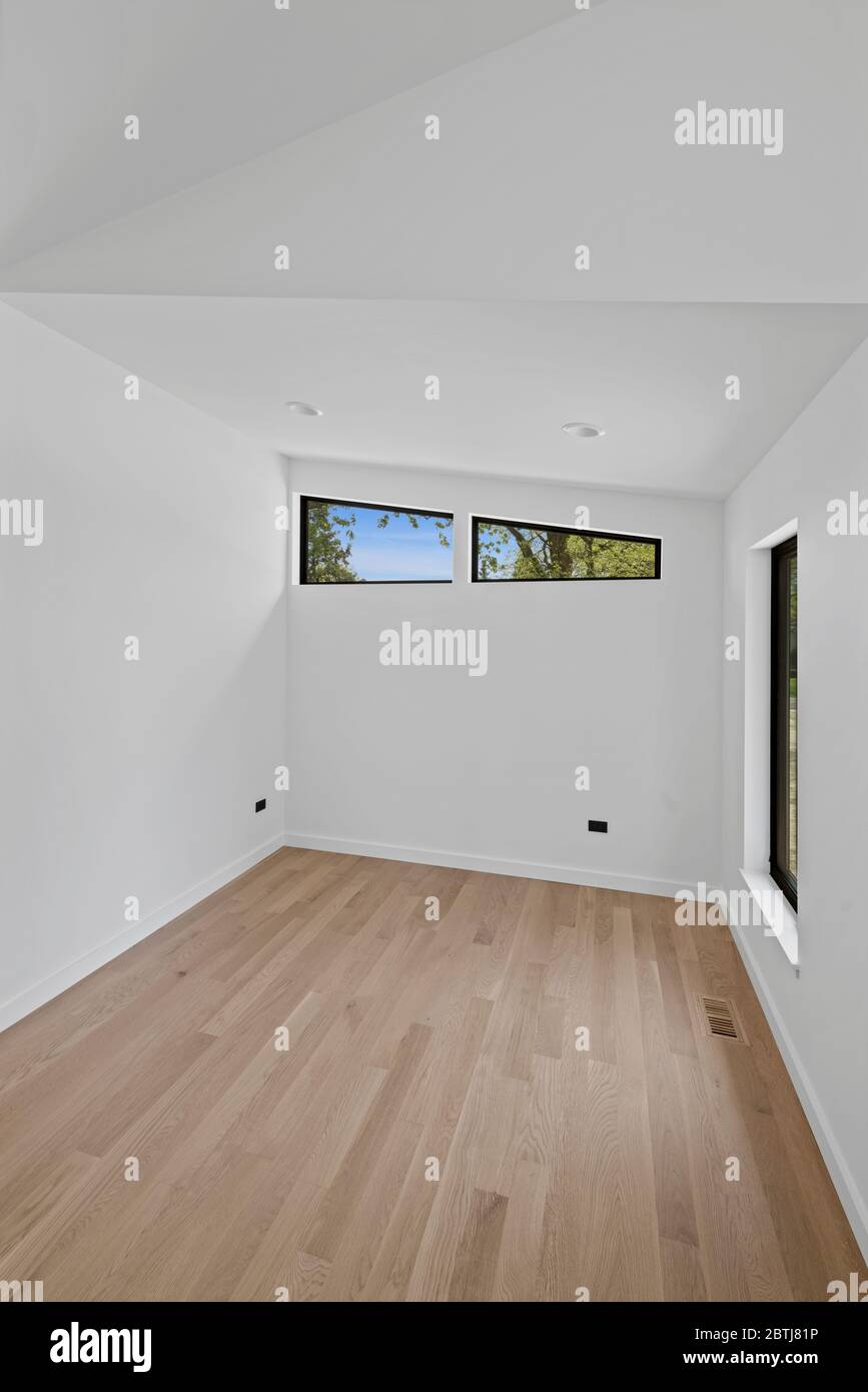 Interior of suburban new construction designed in a mid century revival ...