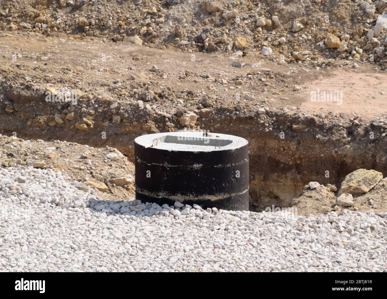 a Construction of sewer hatches. Sewer installation Stock Photo - Alamy