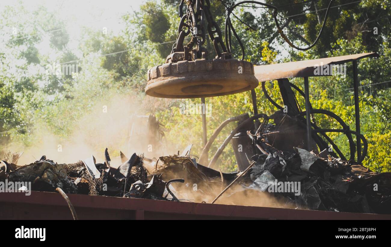 Toned image of electric industrial magnet for sorting metal waste on ...