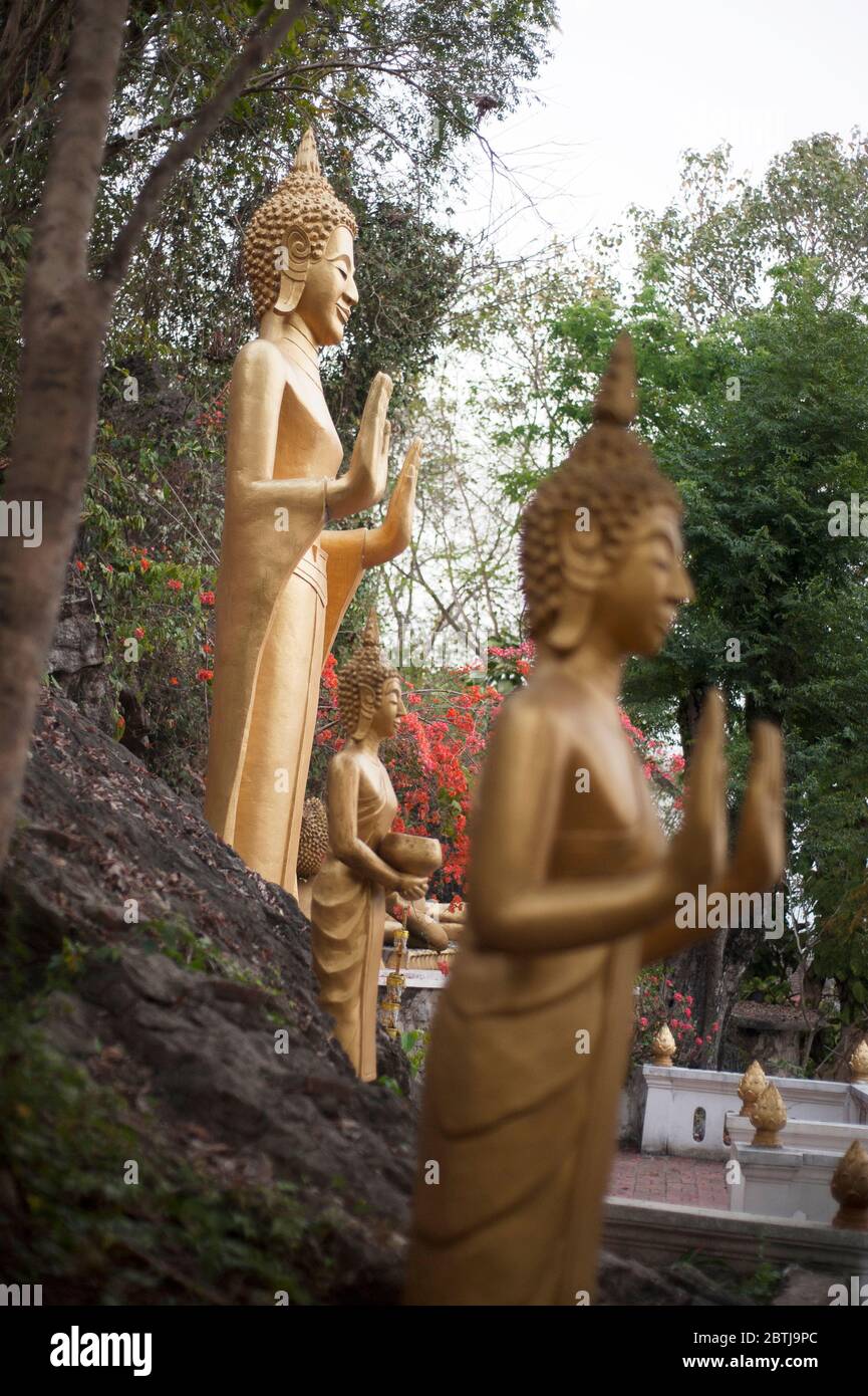 Laos luang prabang wat phousi standing buddha hi-res stock photography ...