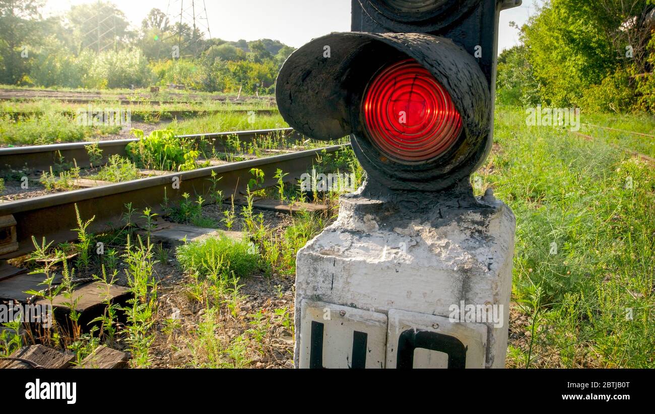 Old semaphore with red light on industrial railroad Stock Photo - Alamy