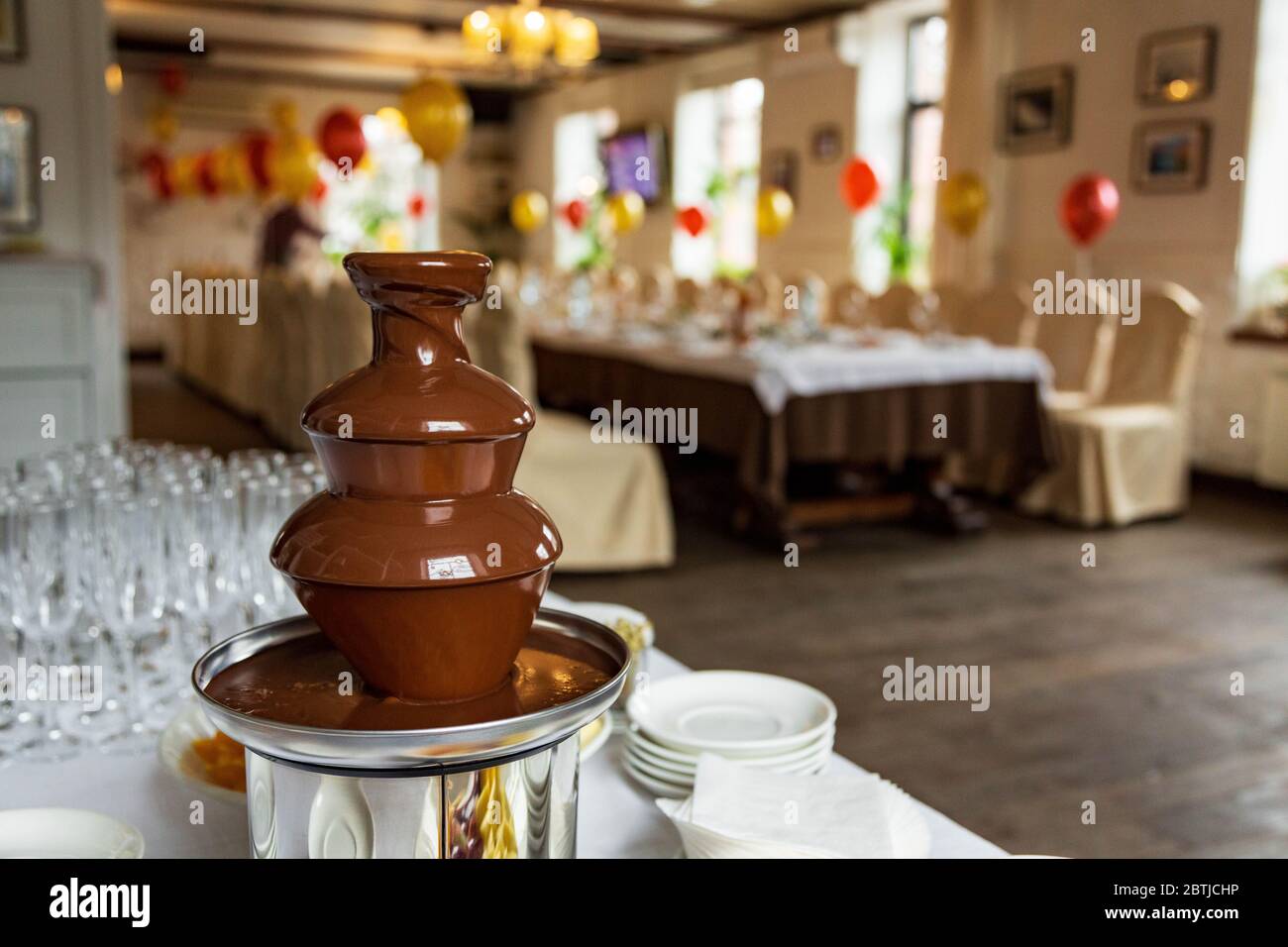 Chocolate fountain, fondue in the banquet hall Stock Photo - Alamy