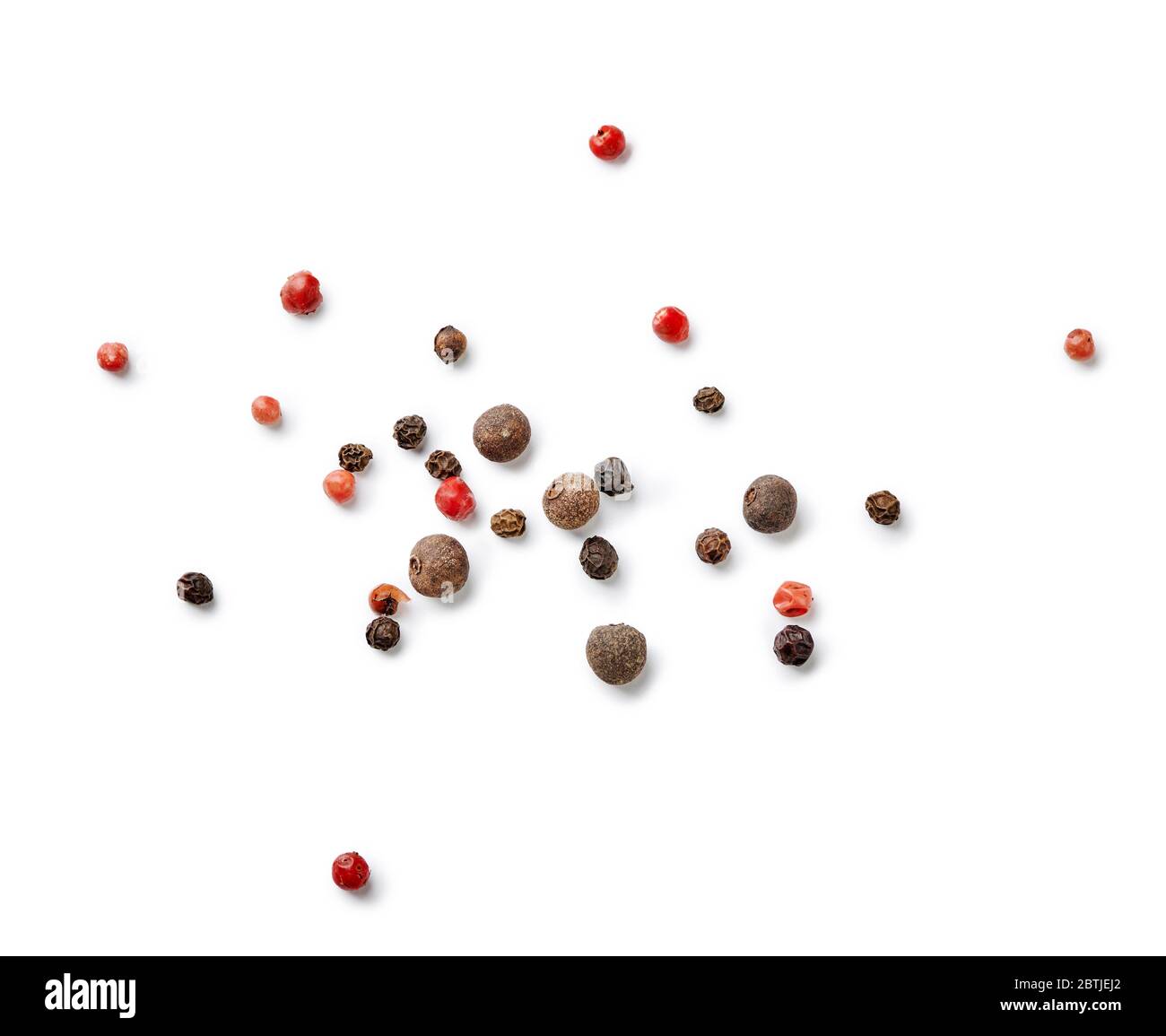 Mix of black and red pepper, pimento isolated on white background. Top ...
