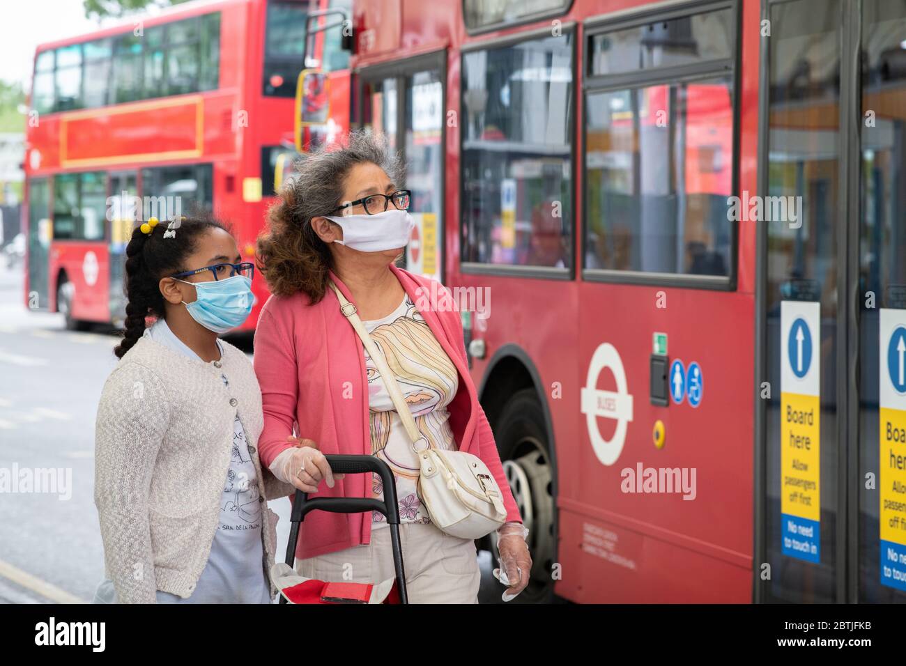 Commuters wear face coverings on London buses as they return to work ...