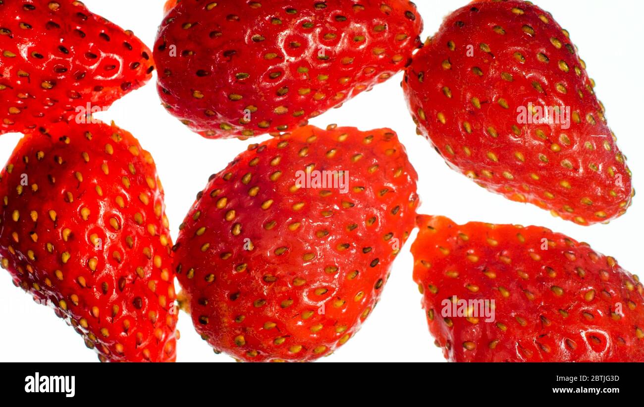 Macro isolated image of ripe sweet red strawberries over white ...