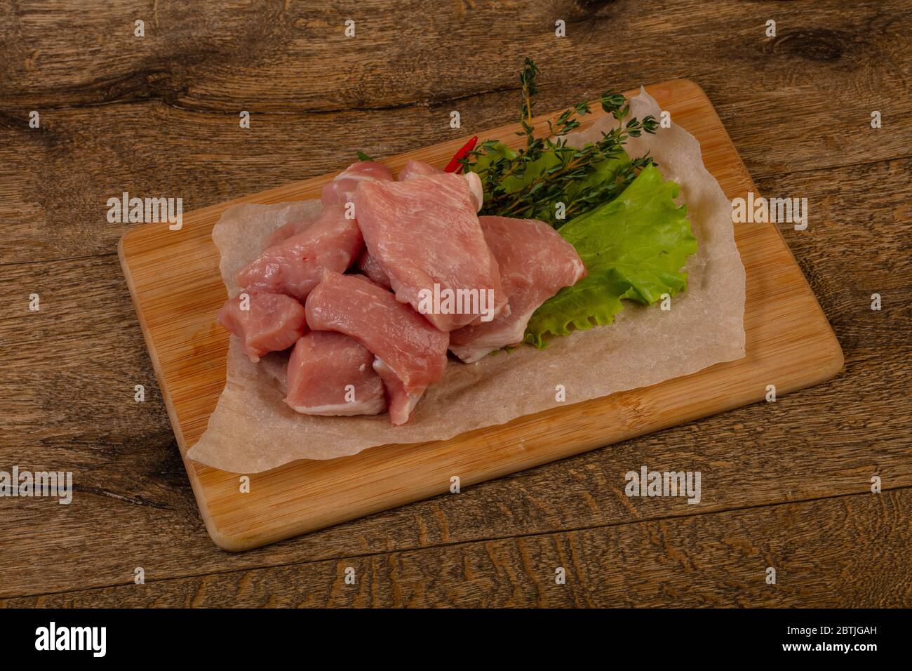 Raw pork meat heap for roast Stock Photo - Alamy