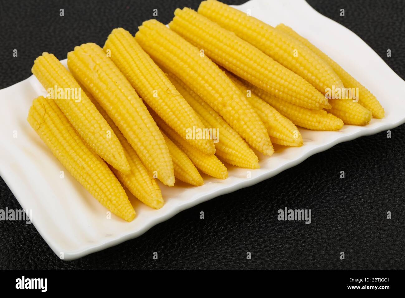 Pickled baby corn in the bowl Stock Photo - Alamy