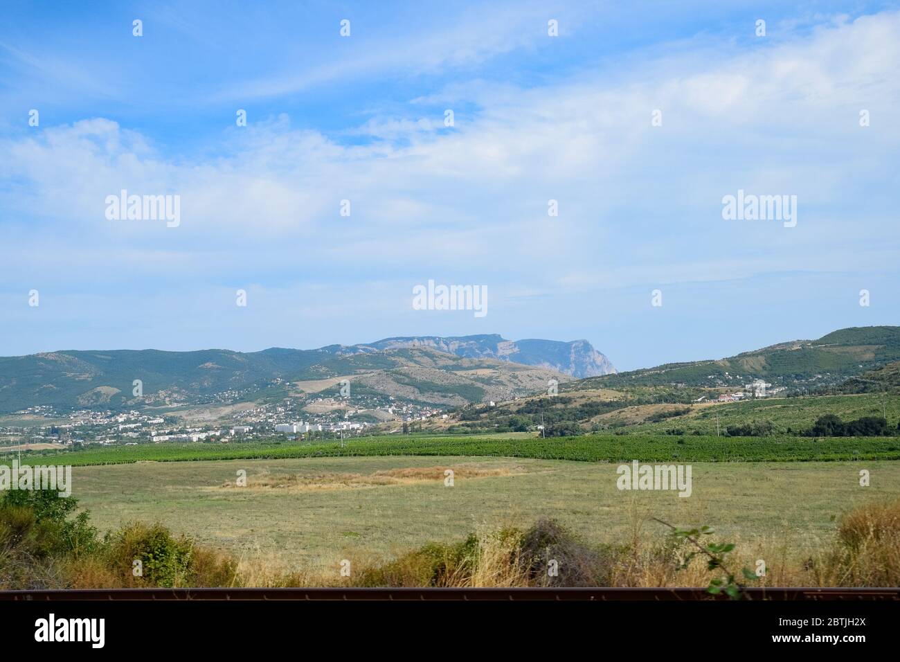 Landscapes of Crimean nature. Fields and hills visible from car window ...