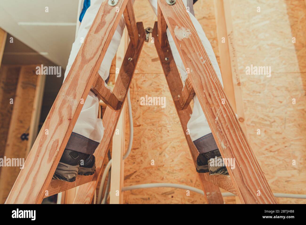 Home Improvement Contractor Worker Staying on Wooden Ladder ...