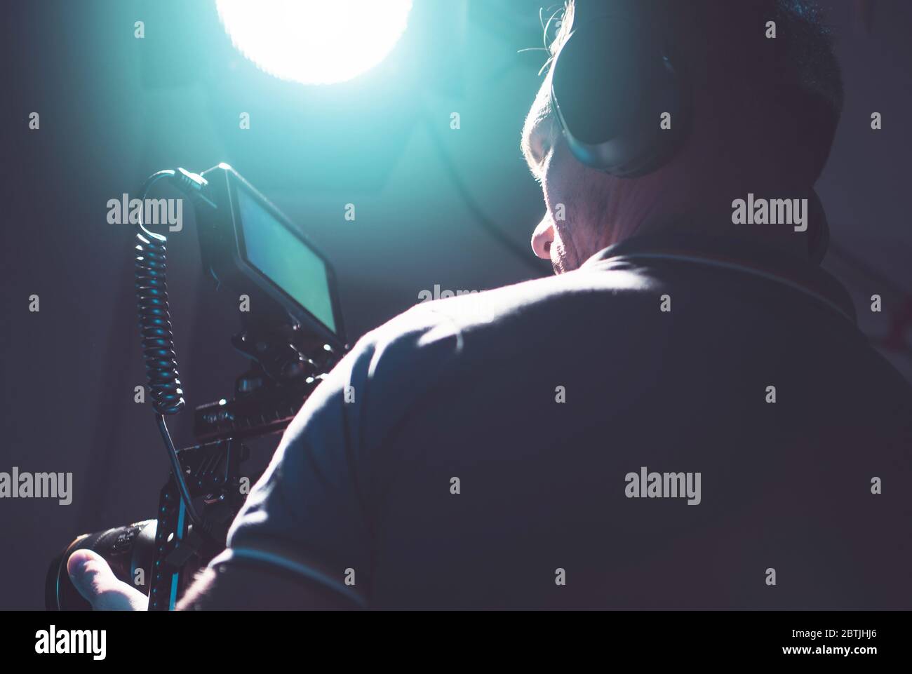 Videographer using camera rig record hi-res stock photography and ...