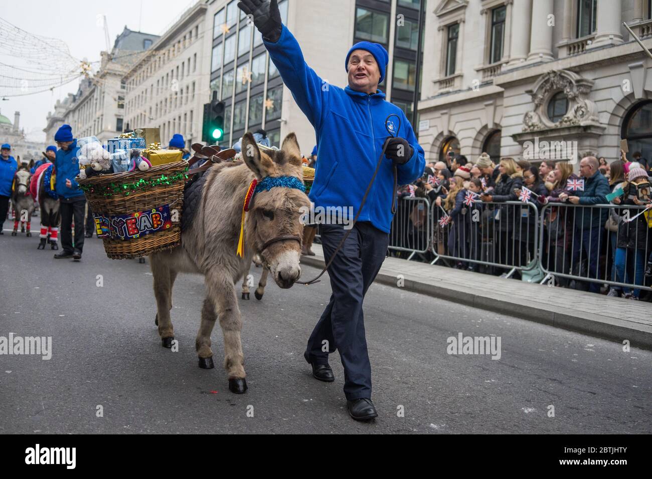 London New Year's Day Parade 2020, Man waving next to a donkey from the ...