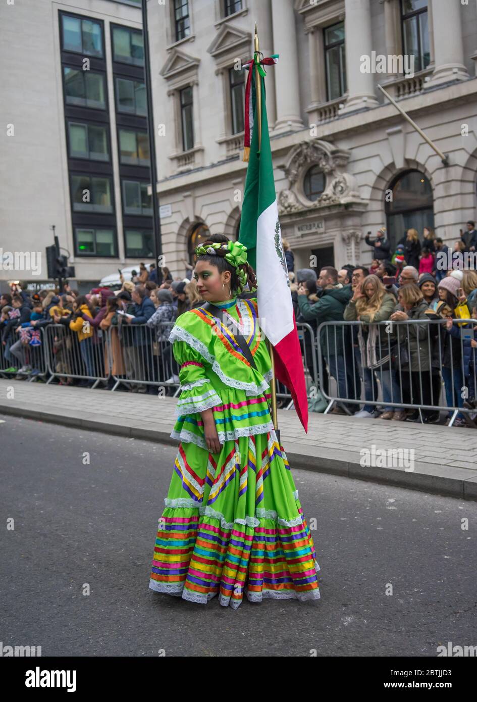 London New Year's Day Parade 2020, Lady in green dress holding flag ...