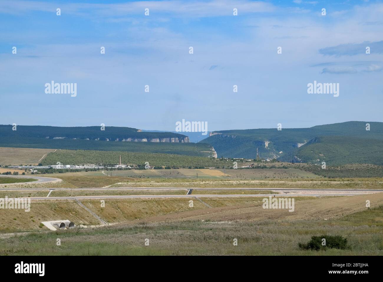 Landscapes of Crimean nature. Fields and hills visible from car window ...