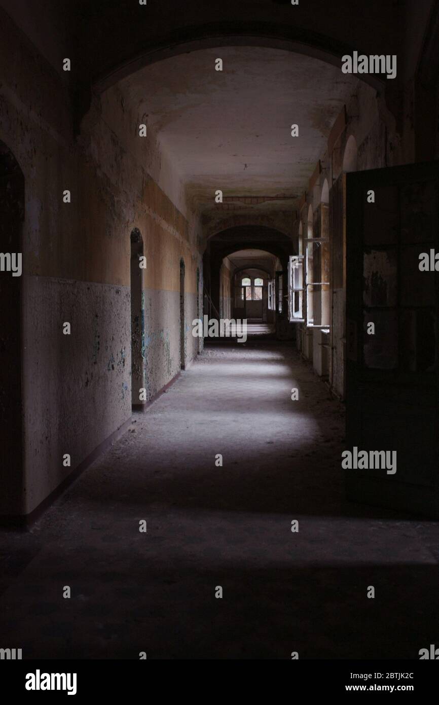 Empty corridor in an abandoned building with windows open Stock Photo ...