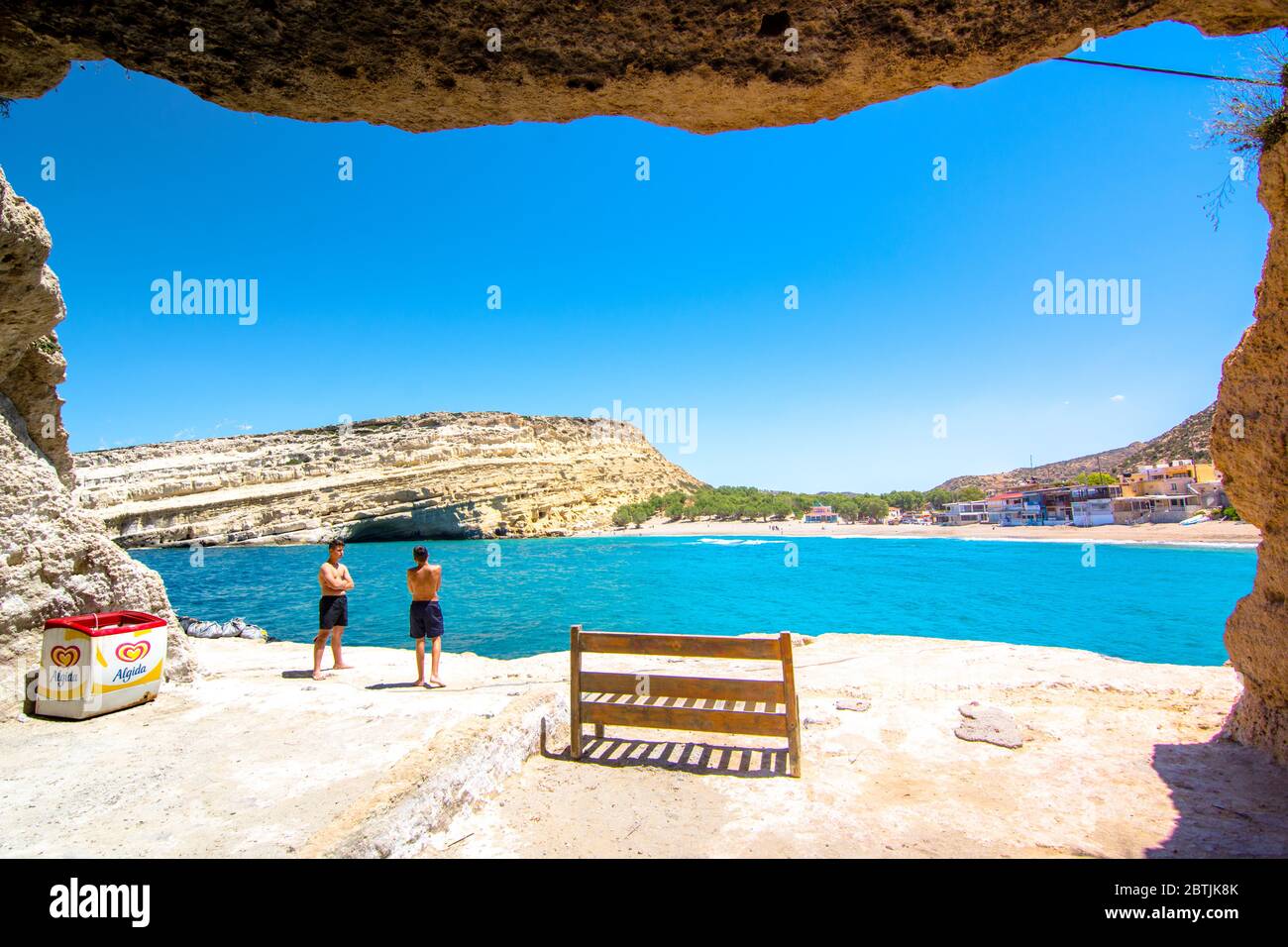 Matala beach with caves on the rocks that were used as a roman cemetery ...