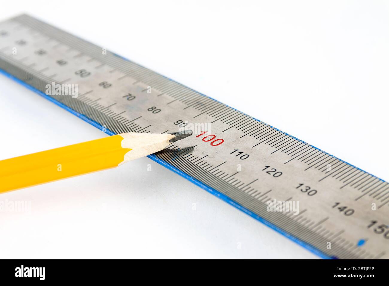 Pencil and ruler lie on a white background Stock Photo - Alamy