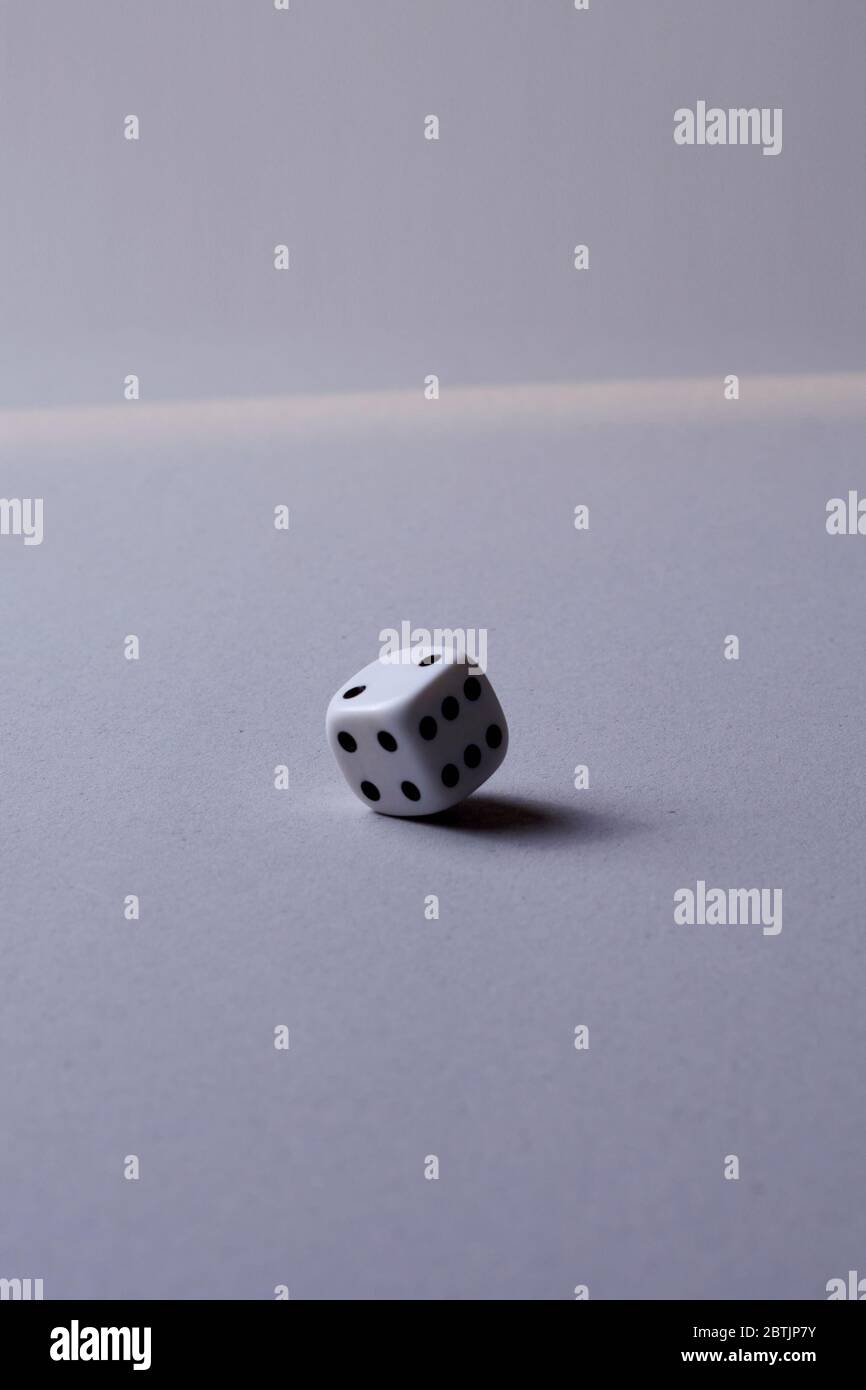 Dice, on white background, in motion, long exposure Stock Photo - Alamy