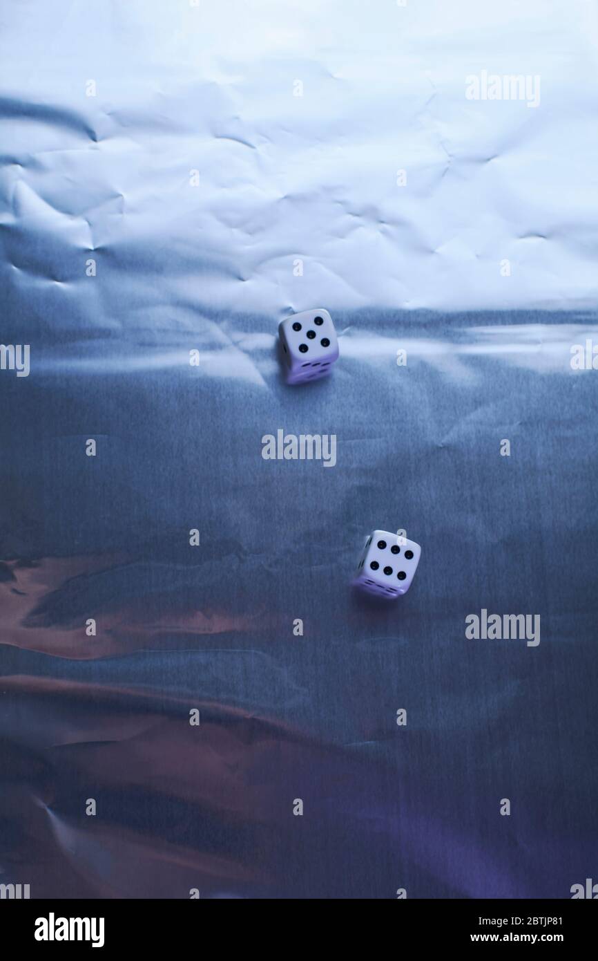 Two dice on silver background, static Stock Photo - Alamy