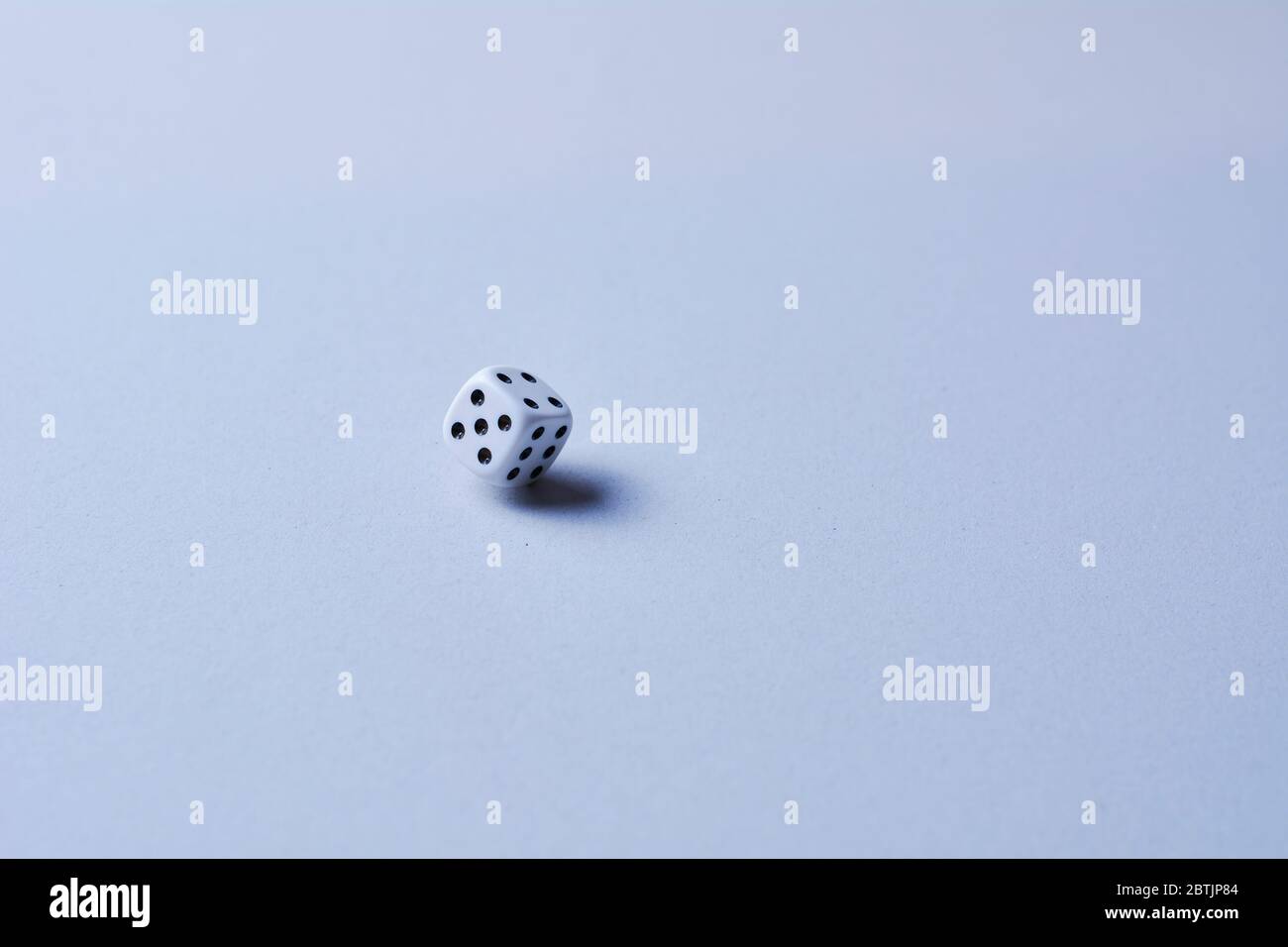 Dice, on white background, in motion, long exposure Stock Photo - Alamy
